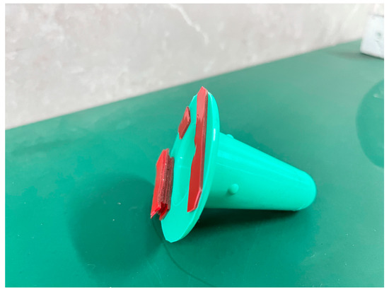 Design of a Teat Cup Attachment Robot for Automatic Milking Systems