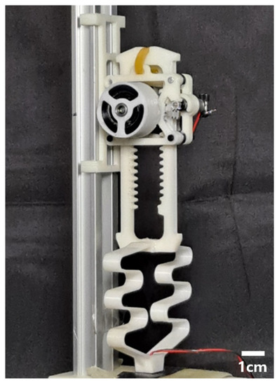 A Small-Scale Hopper Design Using a Power Spring-Based Linear Actuator