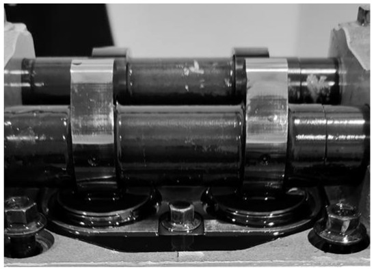 Wear Performance of Circular Shim against Cam in Engine Bench Test