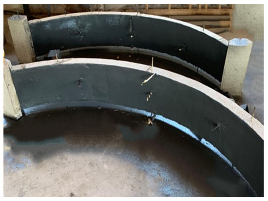 Anti-Blast Performance of Polyurea-Coated Concrete Arch Structures